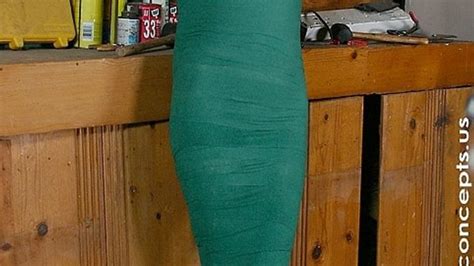 Spunky Blonde Jana Jordan Stands Tightly Wrapped Against The Wall Of A Garage And Talks Until