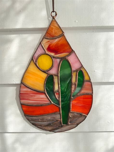 Stained Glass Desert Sunset With Cactus Sun Catcher In Teardrop Swirly Glass In Hues Of Orange