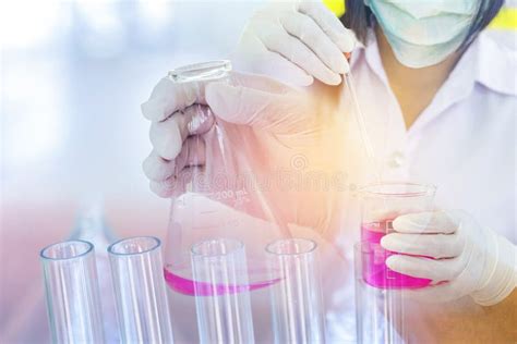 Scientist Woman Dropping Pink Chemical Liquid With Test Tube Glass For Carrying Research