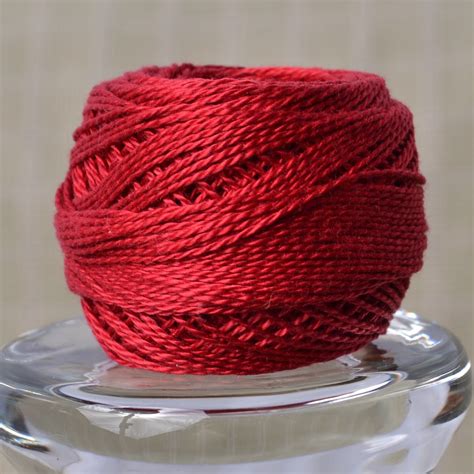threads and needles for hand stitching a threaded needle