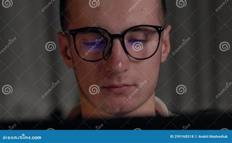 Close Up Focused Young Face Of Programmer In Computer Glasses With