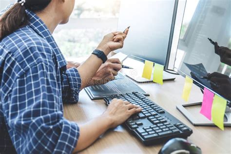 Two Professional Programmers Cooperating At Developing Programming And Website Working In A