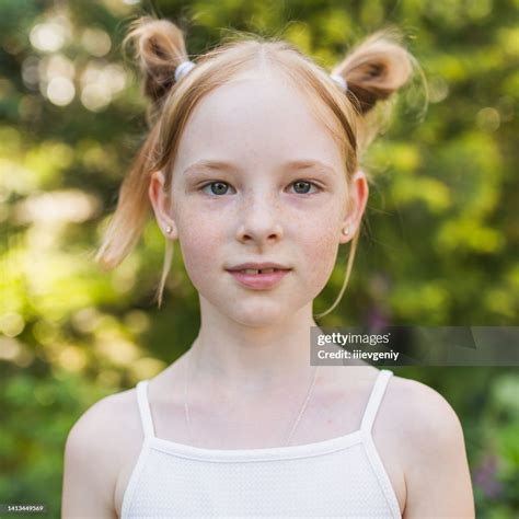 Portrait Of Redhead Girl With Freckles On Summer Blurred Background
