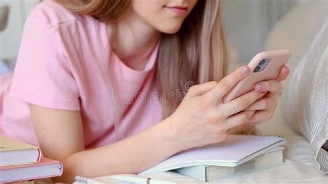 A Young Girl 15 18 Years Old Lies On The Bed With A Phone In Her Hands Stock Footage Video Of