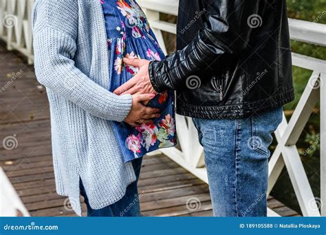Man Holding Belly Of His Pregnant Wife Pregnant Woman And Loving Husband Hugging Tummy Stock