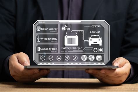 사업가는 태블릿을 사용하여 응용 프로그램으로 자동차를 제어합니다 에코카는 자동차의 상태를 쉽게 제어하고 확인할 수 있습니다 전기 자동차 운송 차량 미래의 대안 재생 가능