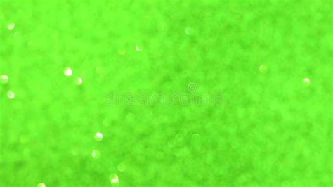 Abstract Green Glitter Background With Moving And Flicker Particles Magic Dust Shiny Texture