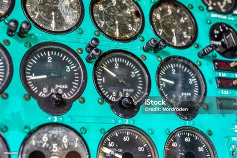Dashboard Of An Old Airplane Many Analog Pointers Buttons And Switches