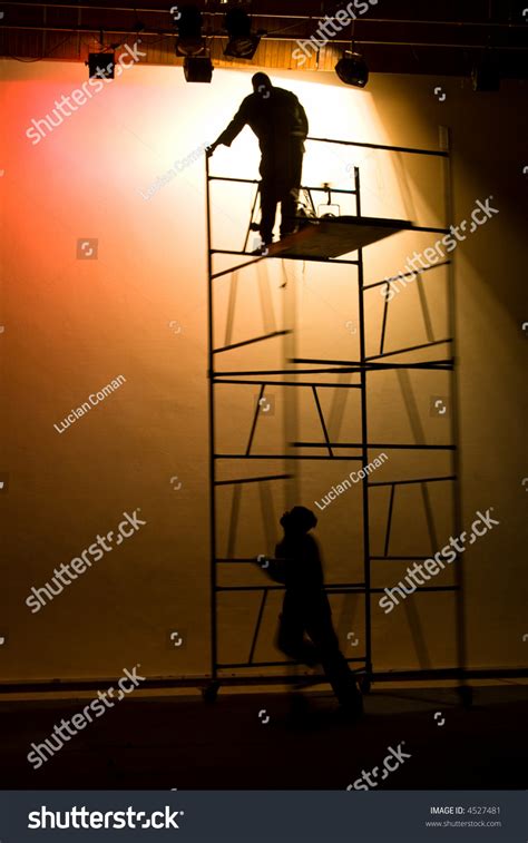 Man On Scaffolding Fixing The Stage Lights Preparing For The Show Stock Photo 4527481