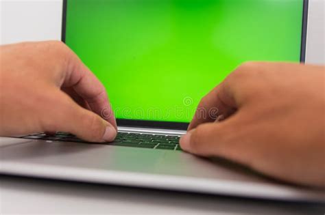 man hand typing on metal notebook keyboard with green screen stock image image of entrepreneur