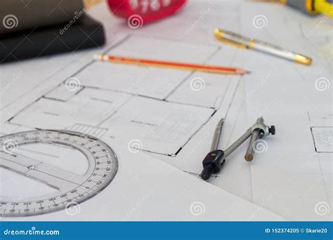 Measurement Tool And Dividers Or Compasses On Blueprint Architectural Concept Stock Image
