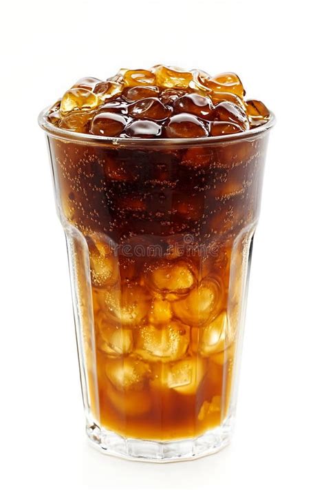 A Clear Glass Filled With A Dark Carbonated Beverage Likely Soda Topped With Ice Cubes Stock