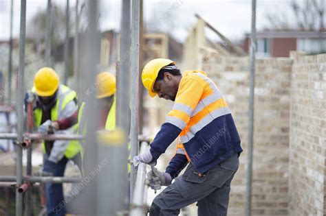 Construction Worker Assembling Scaffolding Stock Image F0345899 Construction Worker Assembling Scaffolding Stock Image F0345899