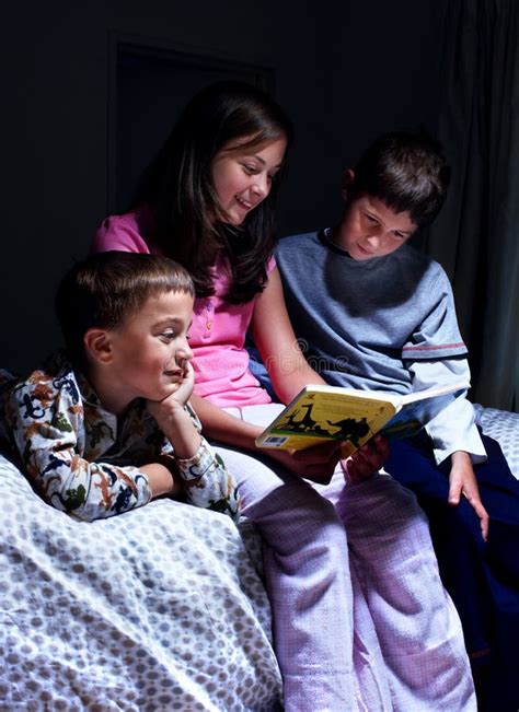 Getting Caught Up In The Wonderful Story A Sister Reading To Her