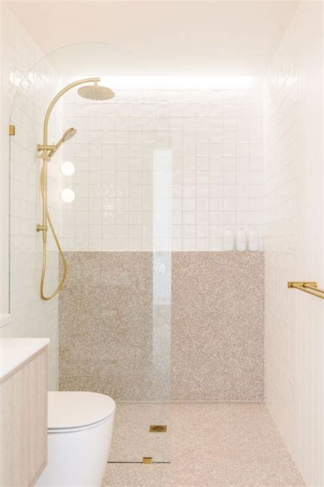 A Neutral Bathroom With Blush Terrazzo And White Square Tiles A