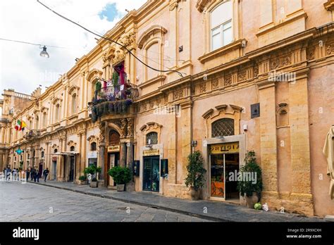 Street View Of Former Jesuit College With Its Large Four Columnsportal In Historic Part Of Noto
