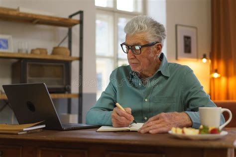 Senior Man Writing Notes In His Diary Stock Image Image Of Coffee Technology