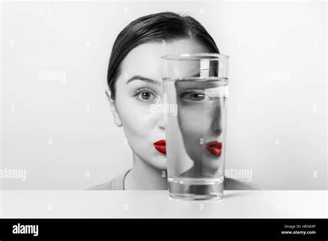 Woman Face Distortion In Glass Of Water Stock Photo Alamy