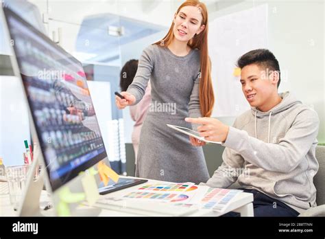 Programmers And Women As Web Developers On The Pc Are Working On A