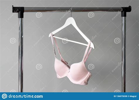 Pink Bra Hanging On A Hanger Textile Underwear Female Bra In Lingerie Underwear Store Stock