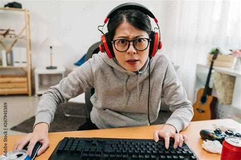 Babe Woman Nerd High Babe Babe Playing Computer Game In Headsets Asian Female Geek Gamer