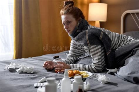 Redhead Woman With Cold Blowing Runny Nose And Swollen Throat Sitting