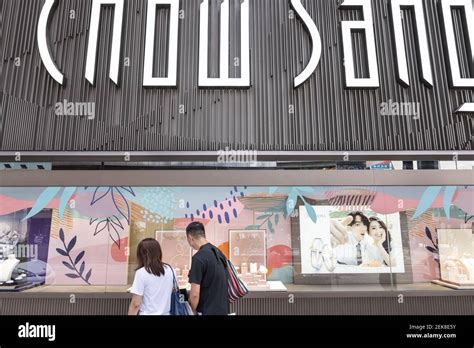 A Couple Window Shopping At A Chow Sang Sang Jewellery Css Store In