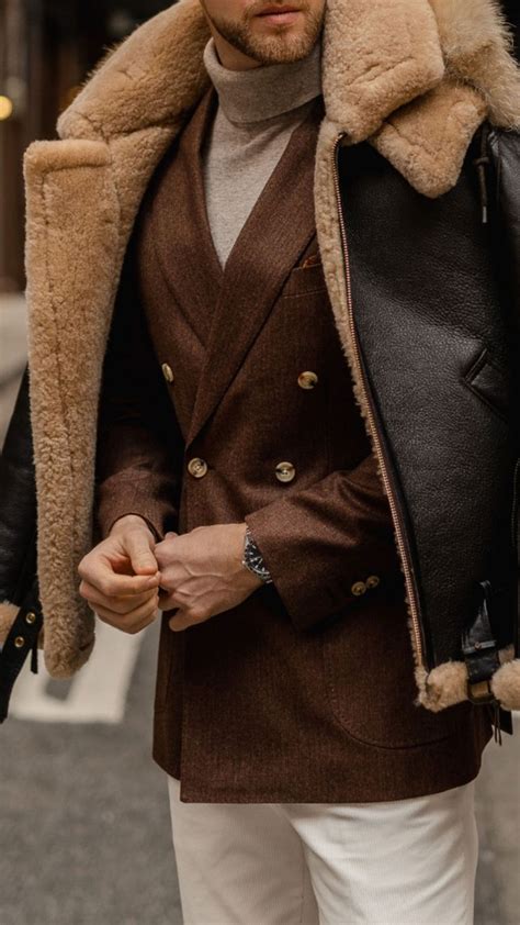 Man Is Wearing A Burgundy Double Breasted Suit With A Grey Turtleneck