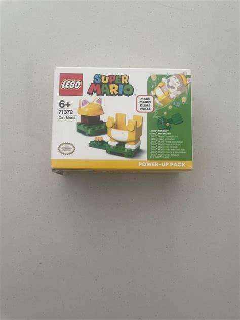 Lego Mario Power Up Suites Mario Cat And Mario Fire Hobbies Toys Toys Games On Carousell