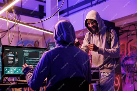 Premium Photo Hacker Holding Ssd Drive With Dangerous Malware And