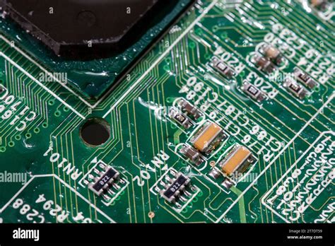 Wet Digital Circuit Board With Microprocessors And Components Closeup