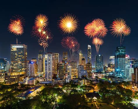 Happy New Year Fireworks Over Buildings Near Witthayu Road At Night In Bangkok City Thailand