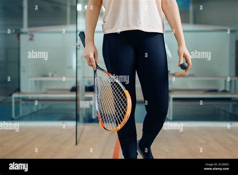 Female Person Shows Squash Racket And Ball Girl On Game Training Active Sport Hobby On Court