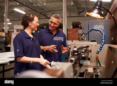 Engineer Training Female Apprentice On Milling Machine Stock Photo Alamy