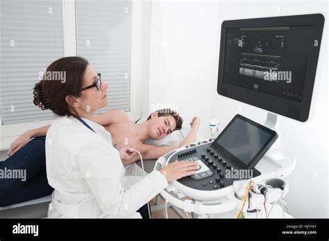 Female Cardiologist Performs Echocardiogram Of The Heart On Teenage Babe Stock Photo Alamy