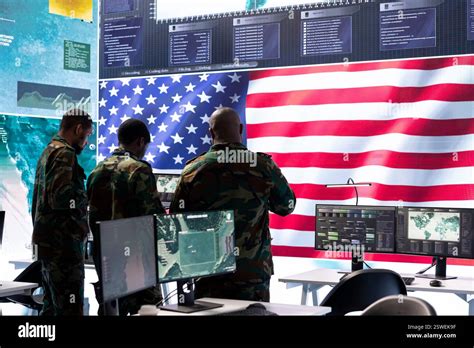 American Military Intelligence Officers In A Command Center Monitoring