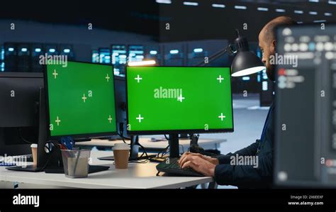 Developer Programming On Multi Monitor Isolated Screen Pc Setup In Data Center Housing