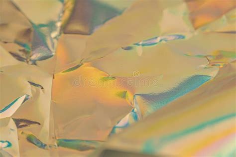 An Abstract Digital Artwork With Iridescent Metallic Shapes Creating A Sense Of Movement And