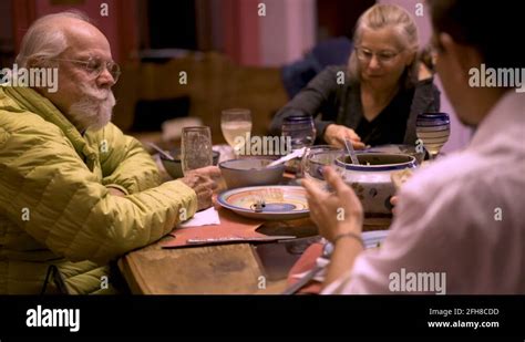 Elderly Grandfather Talking To His Grandson At The Dining Table While Drinking Stock Video