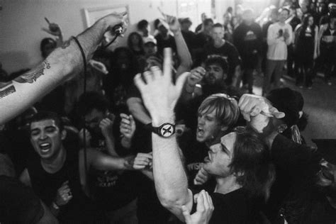 A Group Of People Standing Around Each Other Photo Free Adult Image