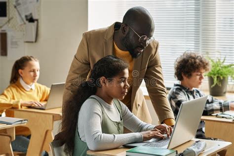 teacher teaching basics of using computer stock image image of lesson