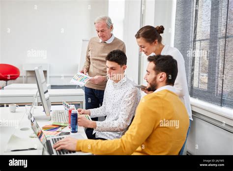 Creative Designer Start Up Team In Meeting Planning New Project Stock