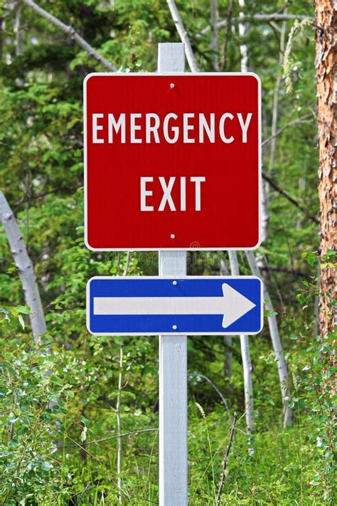 A Emergency Exit Sign With An Arrow Indicating The Direction Stock Photo Image Of Forest