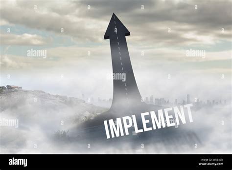 The Word Implement Against Road Turning Into Arrow Stock Photo Alamy