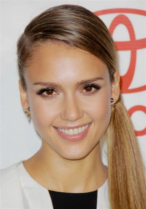 Jessica Alba Wearing Her Hair In A Side Ponytail That Cascades Over Her