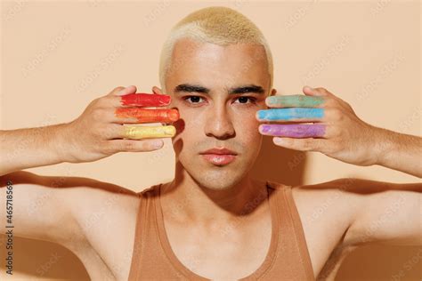 Young Smiling Happy Fun Blond Latin Gay Man Wear Beige Tank Shirt