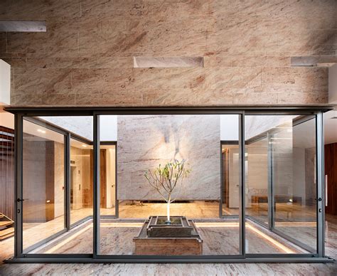 Charged Voids Builds Stone Clad Chandigarh Home Around Courtyard Void