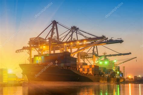 Unloading Container Of Cargo Ship Terminal At Twilight Scene Stock Photo K D P 110279378