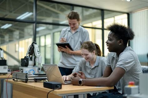 Trainee Robotics Engineer Learning With Programming And Manipulating