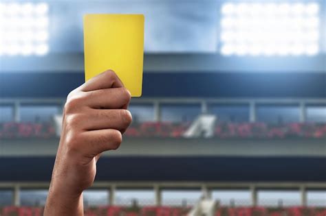 Premium Photo Soccer Referee Hand Holding Yellow Card